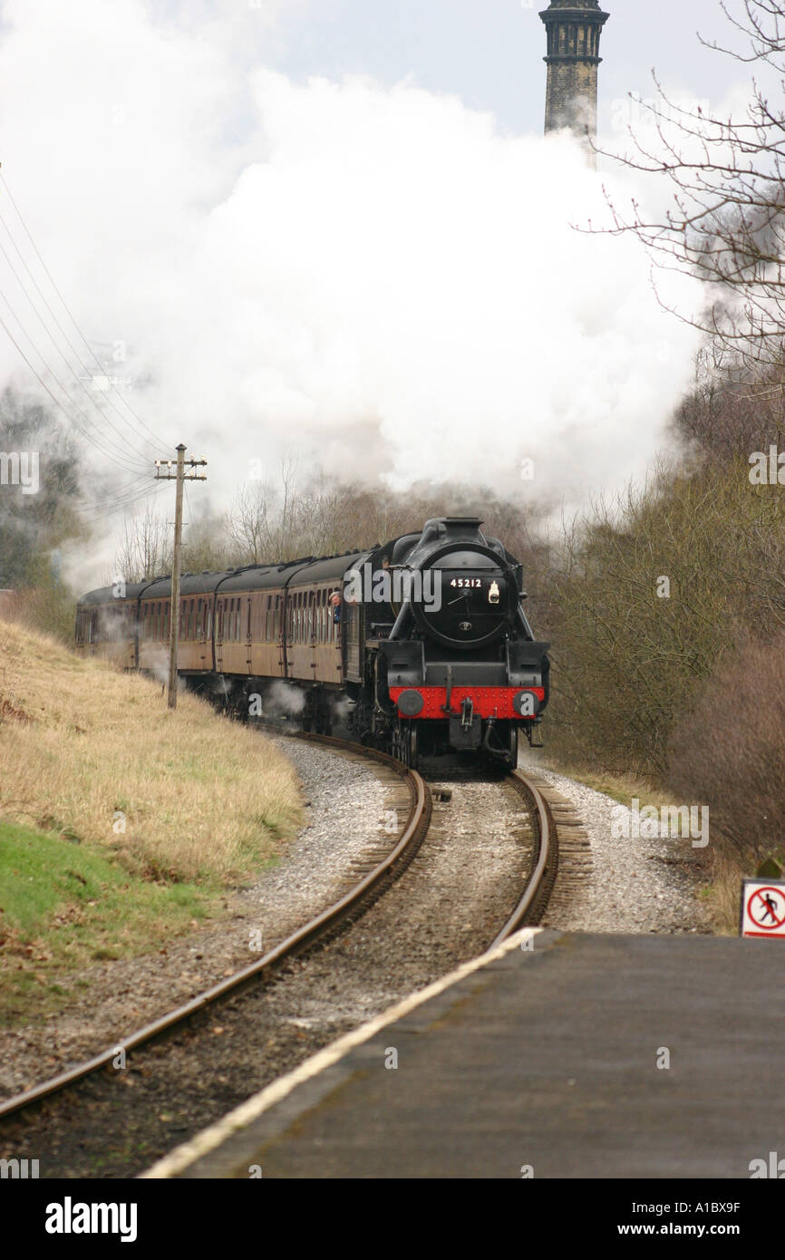 Steam train arriving Stock Photo - Alamy