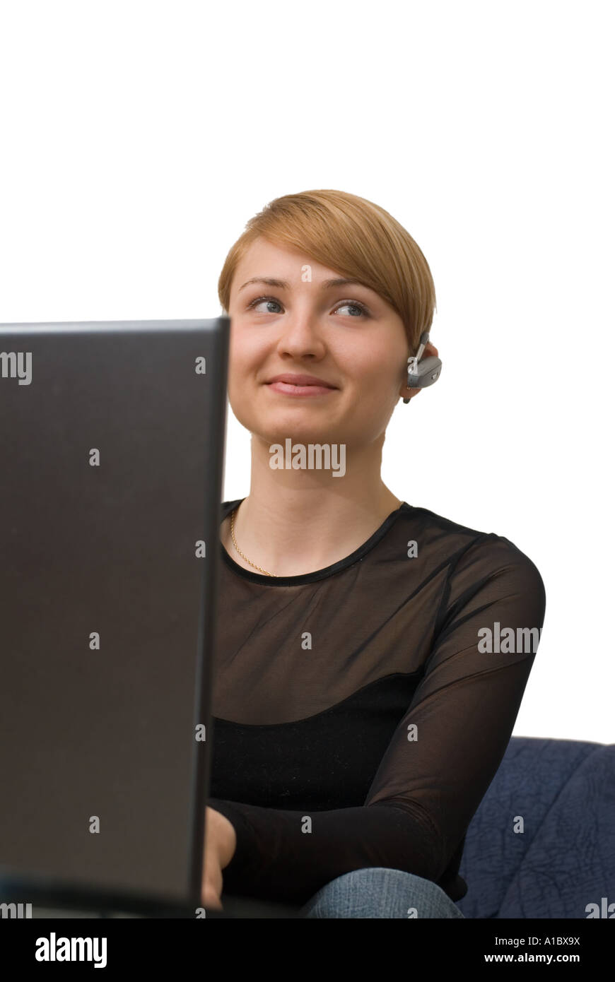 young woman using bluetooth headset Stock Photo - Alamy