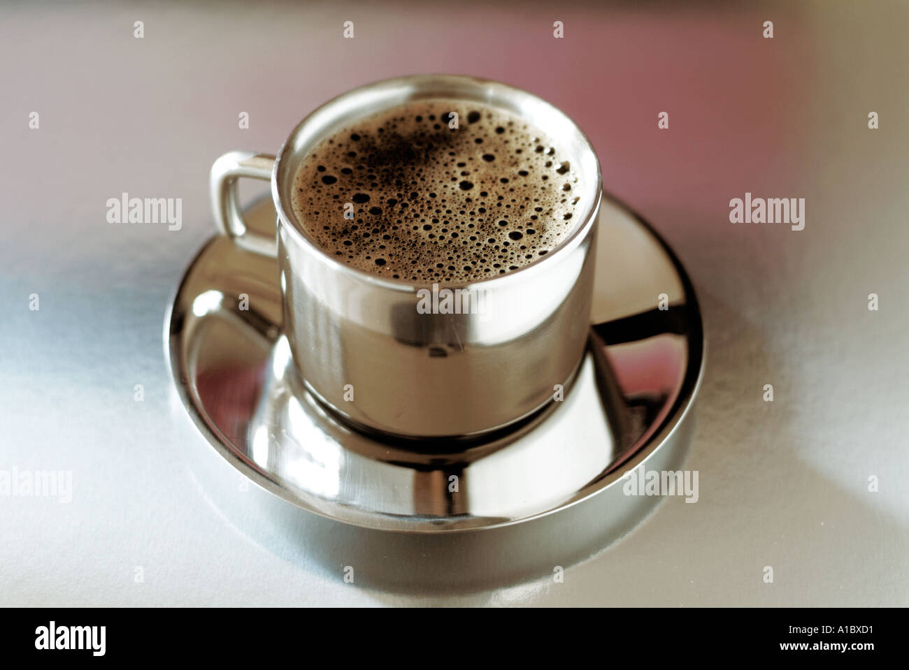 stainless steel cup of black frothy coffee Stock Photo - Alamy