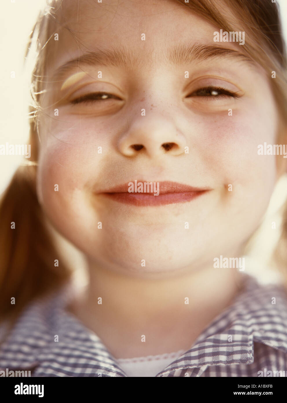 Young school girl smiling Stock Photo - Alamy