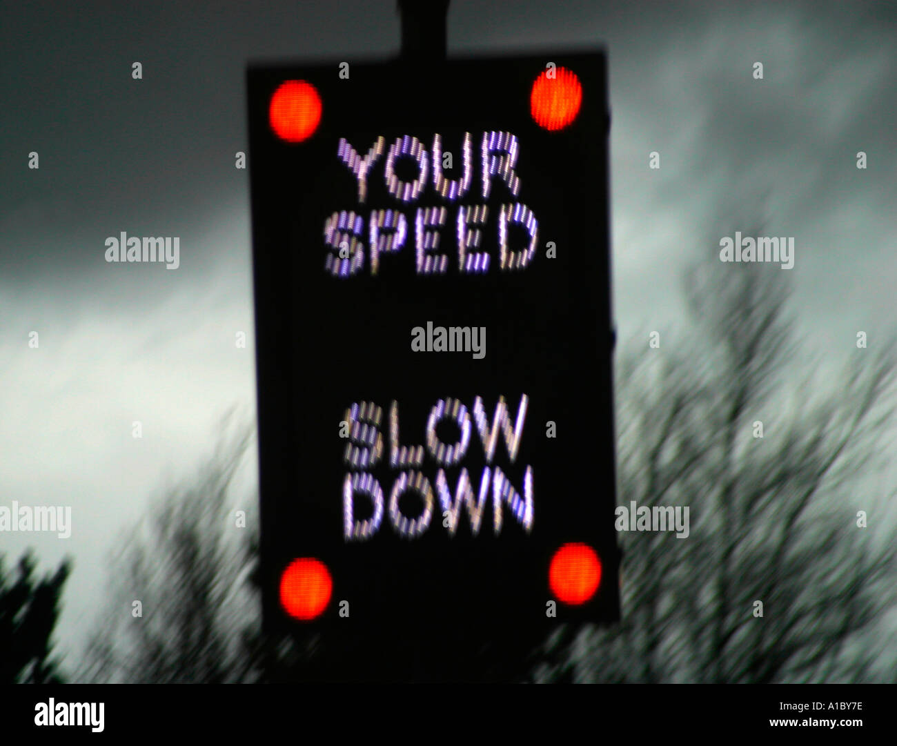 Illuminated road sign to warn of excessive speed Stock Photo - Alamy