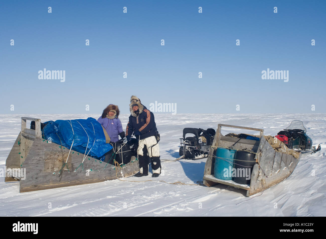 Inupiat guides with snow machines and sleds travelling to Herschel ...