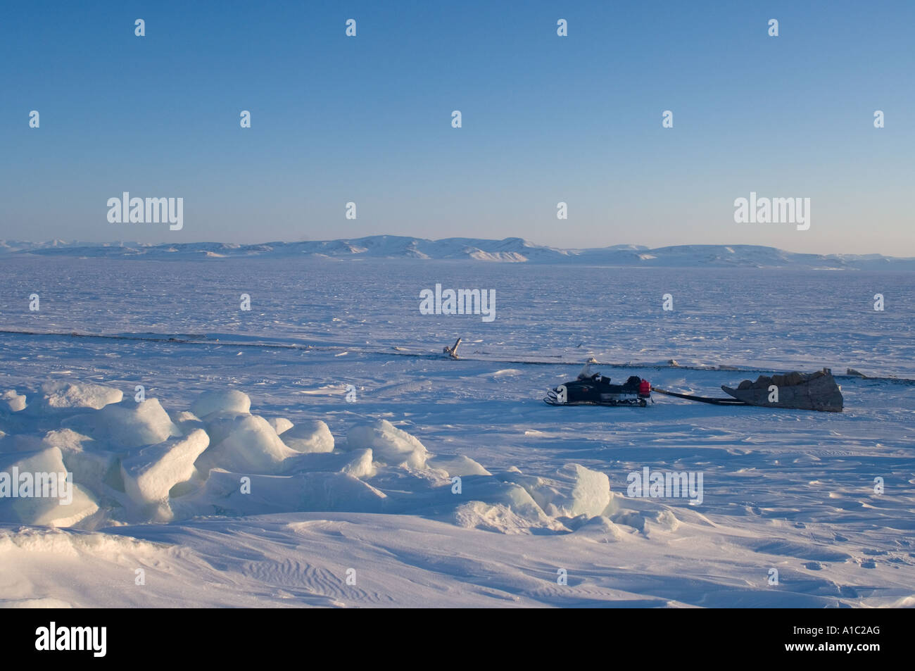 snow machine and sled on the frozen Arctic ocean off Herschel island ...