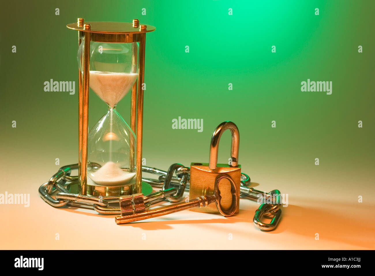 Hourglass with Padlock, Key and Chain Stock Photo - Alamy