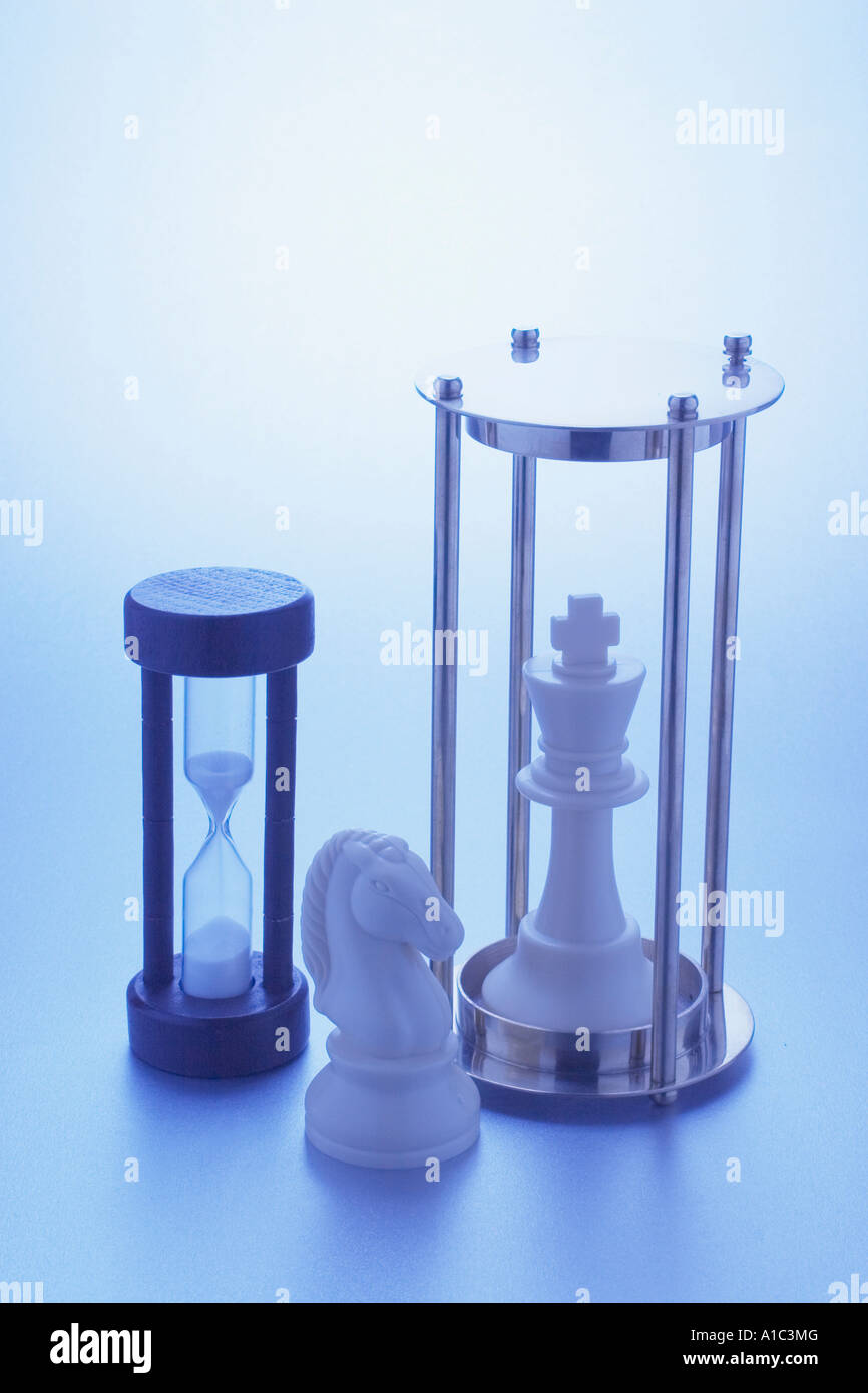 Sand Timer and Chess Pieces Stock Photo - Alamy