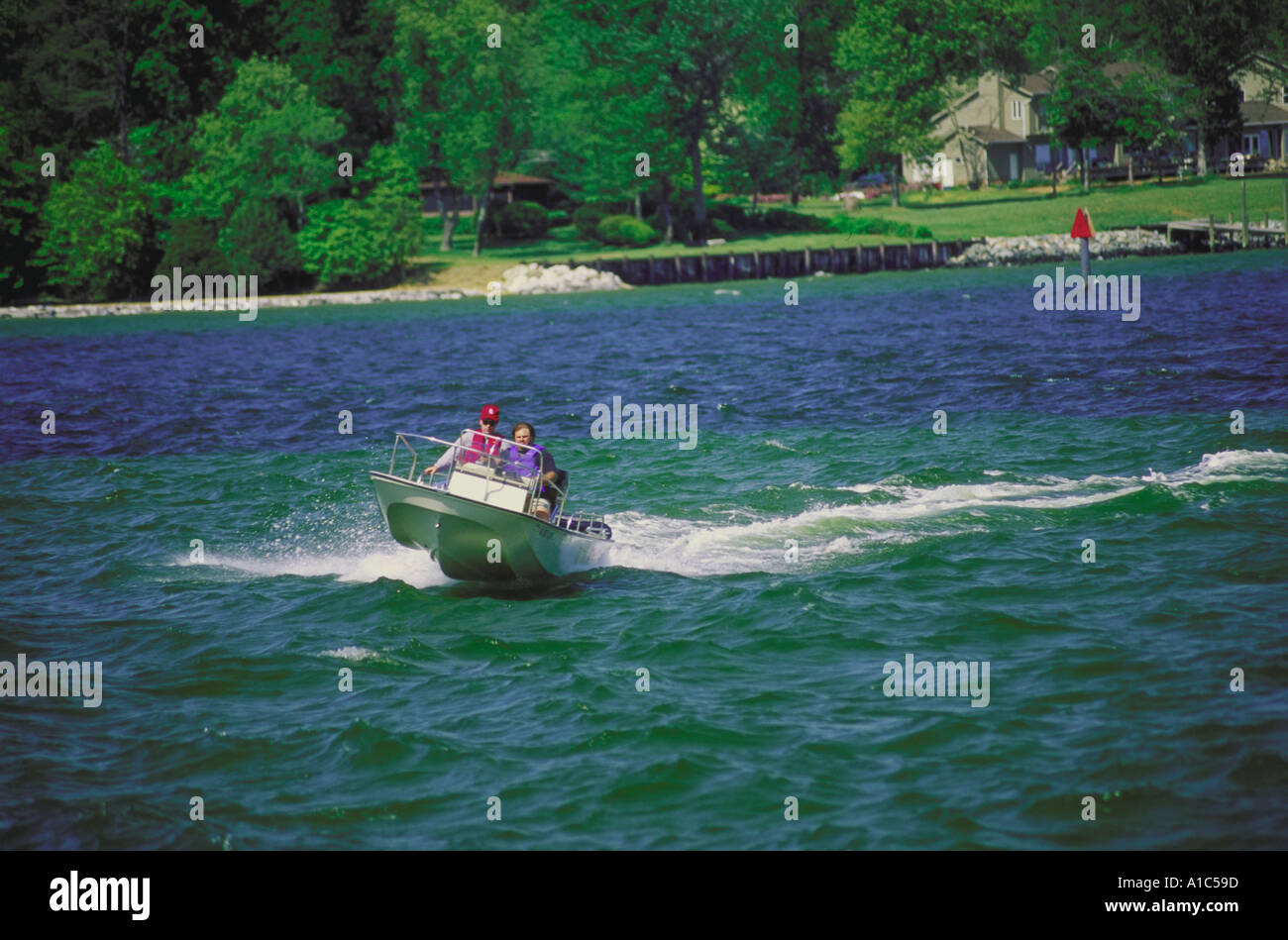 Two men in power boat Stock Photo - Alamy