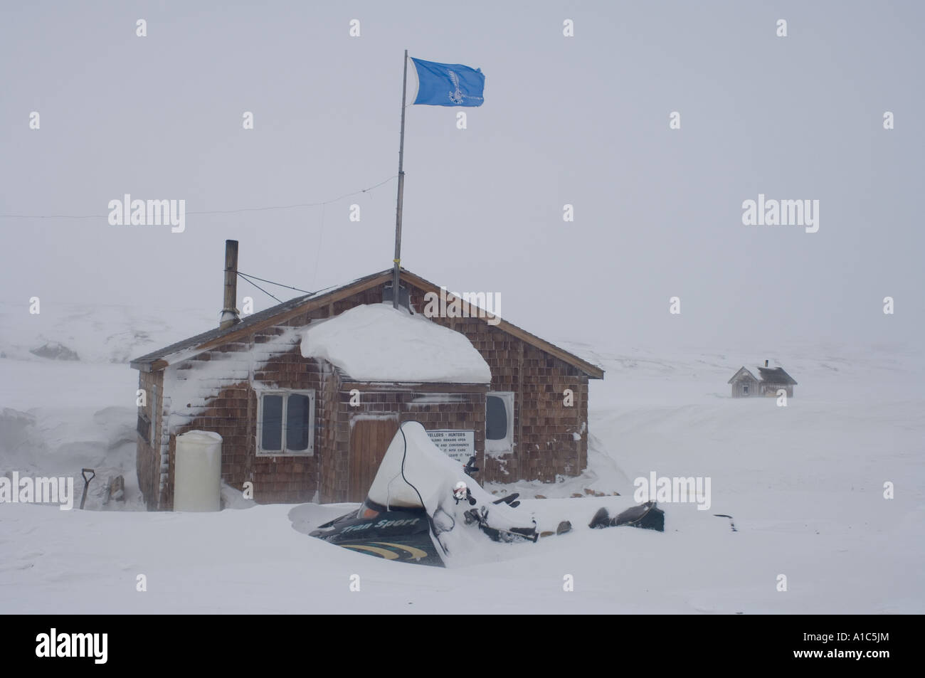 snow machine buried in snow Herschel Island off the Mackenzie River ...