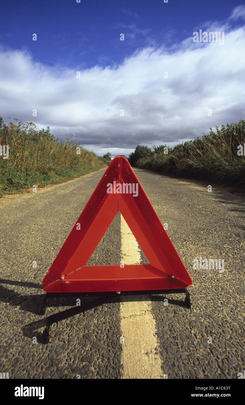 hazard warning triangle on country road warning of possible hazard ...