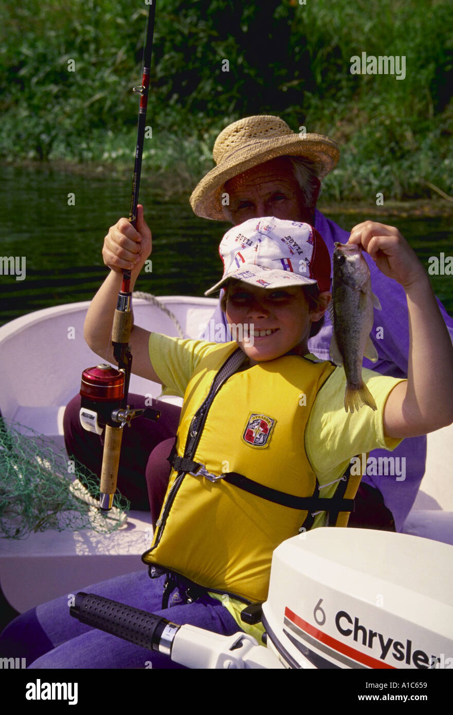 12 yr old boy with small mouth bass Central Florida Stock Photo - Alamy