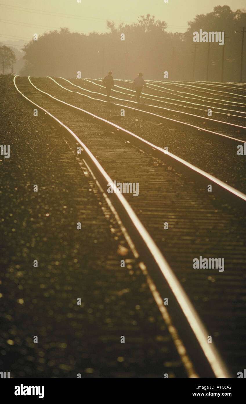 Railroad tracks converging into the distance Atmospheric lighting Stock ...