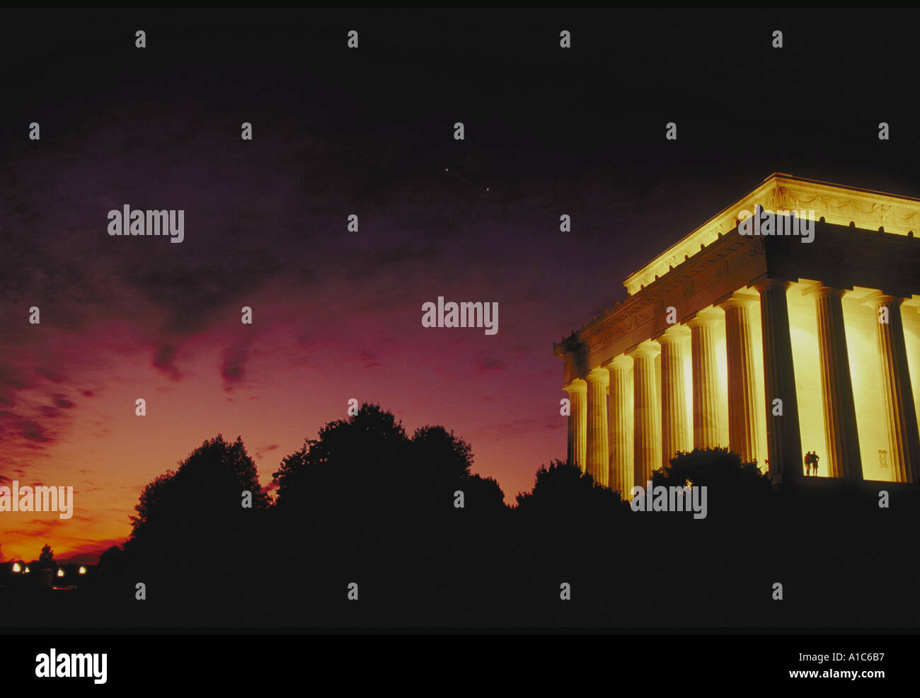 The Lincoln Memorial growing from illumination behind the outer columns ...