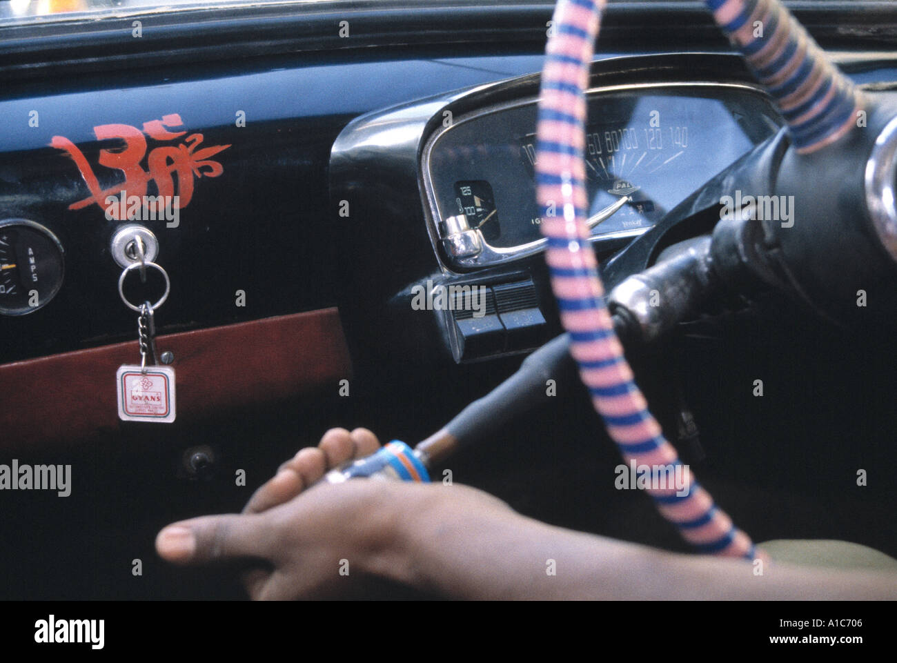 An om or aum symbol ॐ on a car dashboard in India Stock Photo - Alamy