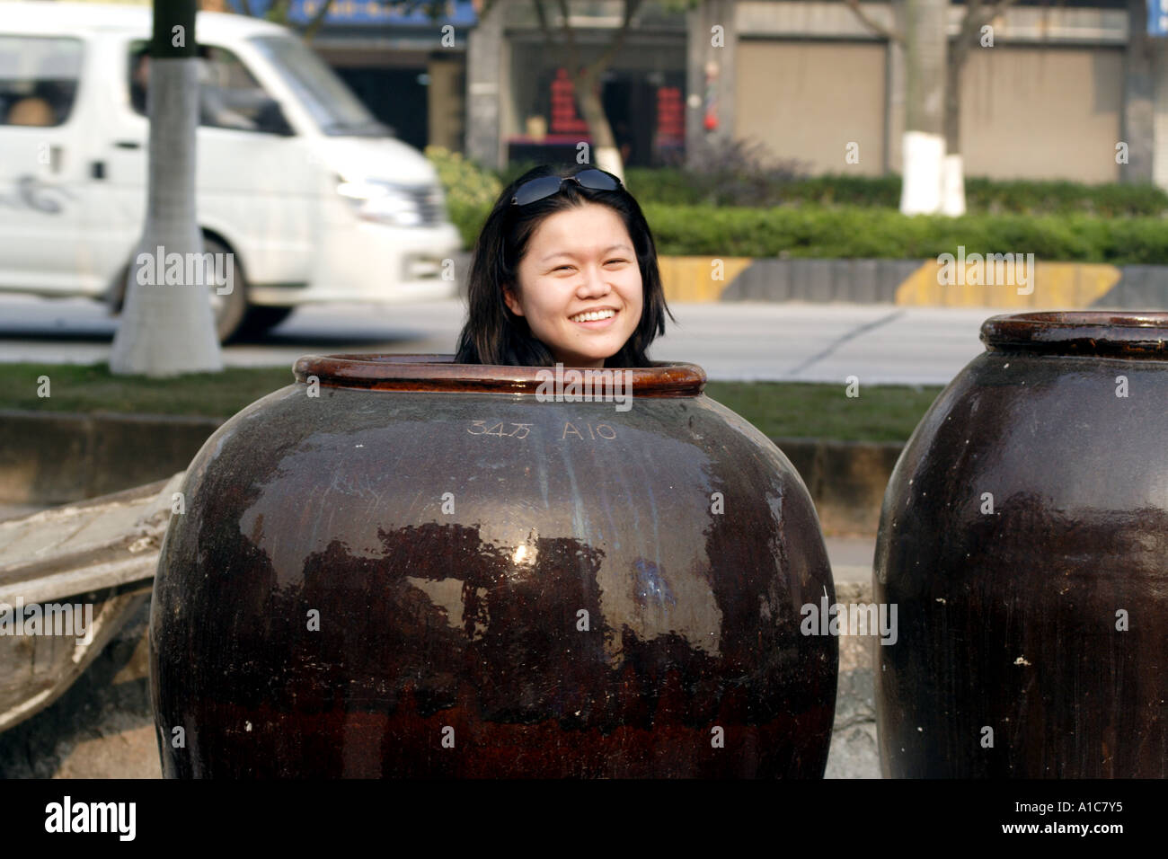 Shan is inside a huge antique pot and happy pot at the Zhongshan China ...