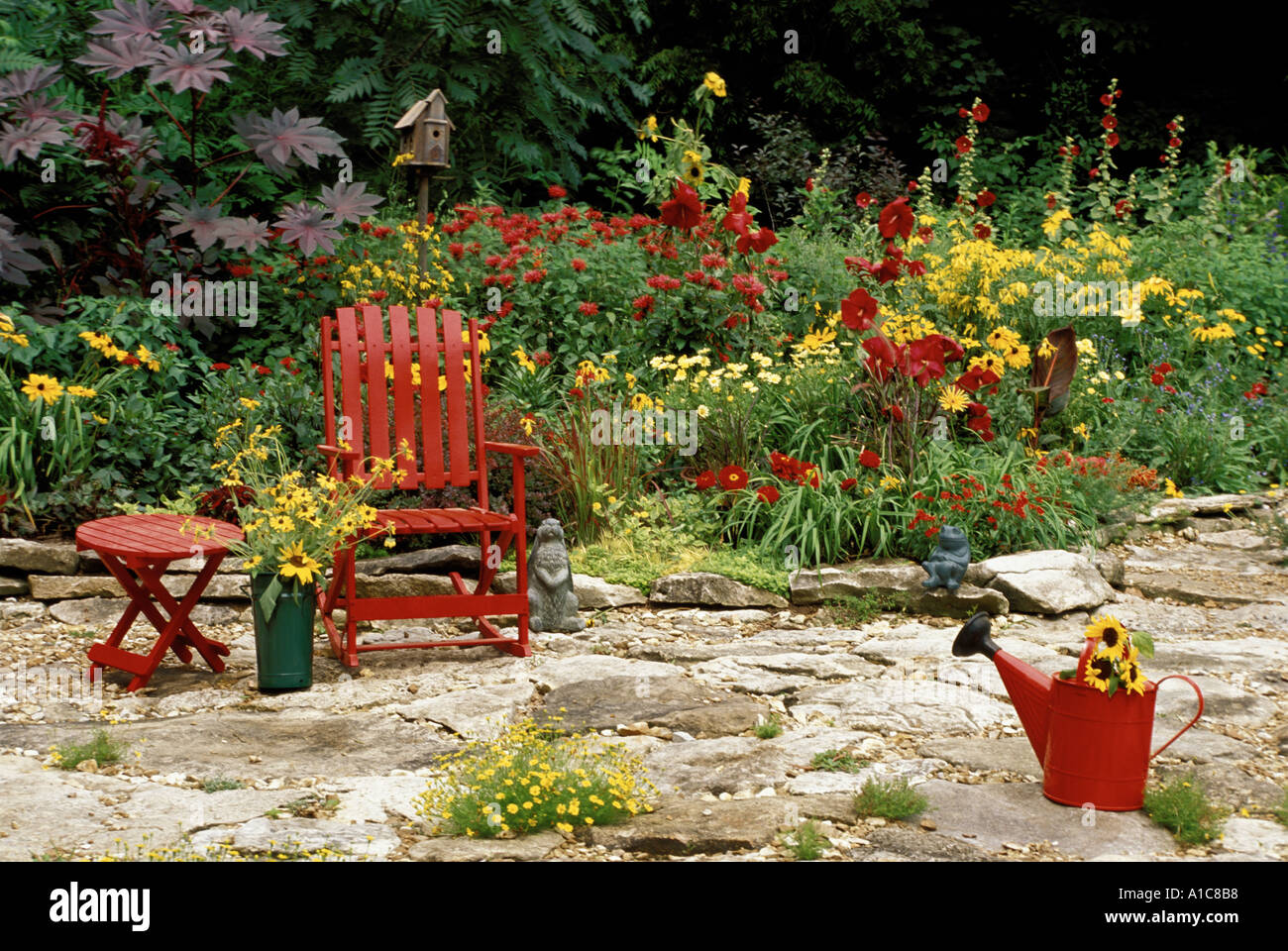 Red Garden: Red painted furniture on flagstone patio by garden with ...