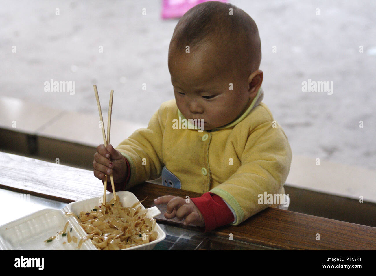 China Boy Eating Chopsticks High Resolution Stock Photography and ...