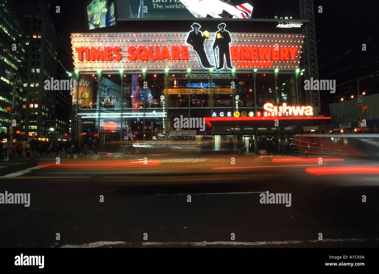 Cars passing on Times Square at night, New York City USA Stock Photo ...