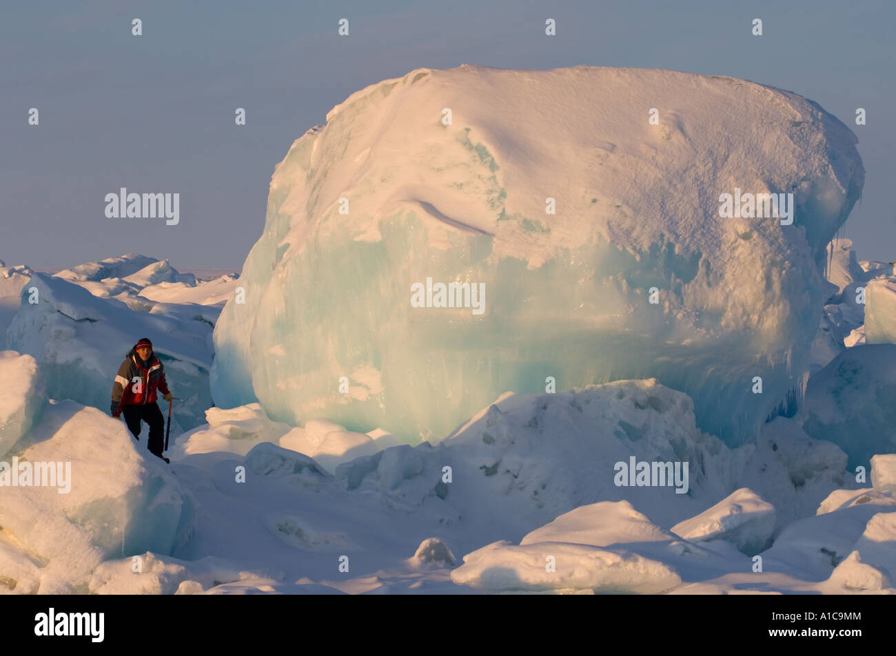 Stacy Hopson walks by a giant ice ball on the frozen Chukchi Sea during ...