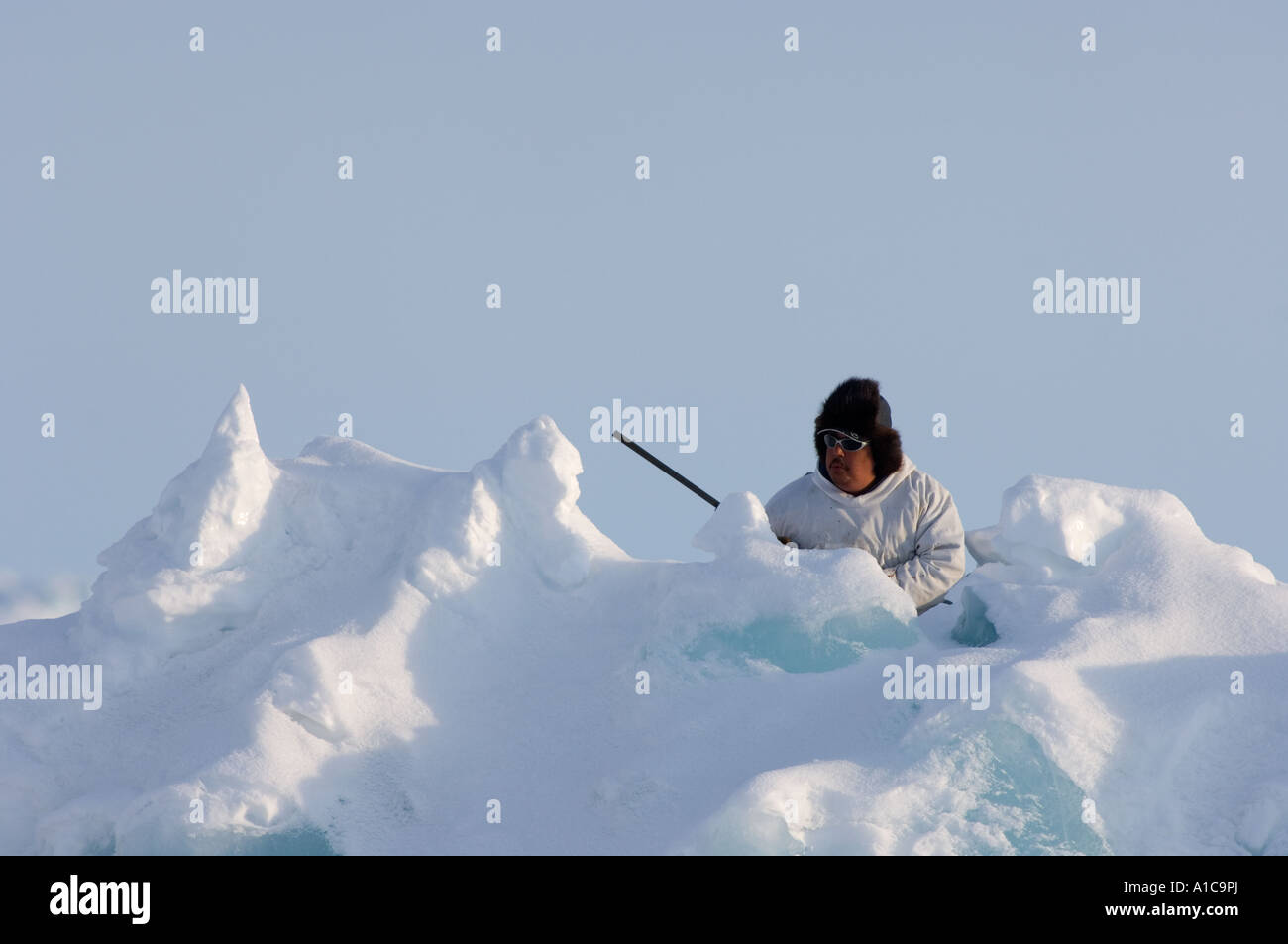 inupiat duck hunter at the edge of a lead on the frozen Chukchi Sea off ...