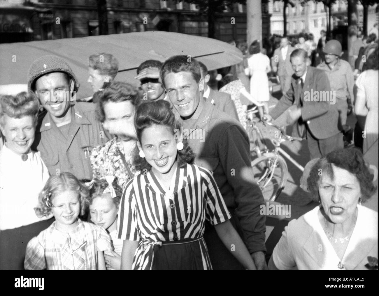 WW II liberation of Paris civilian crowd with American officers ...