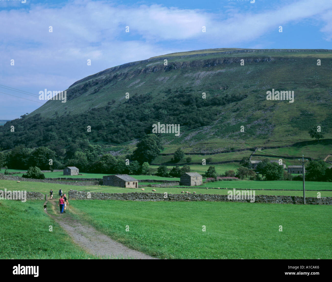 Walkers at Ramps Holme Bridge, near Muker, Upper Swaledale, Yorkshire ...