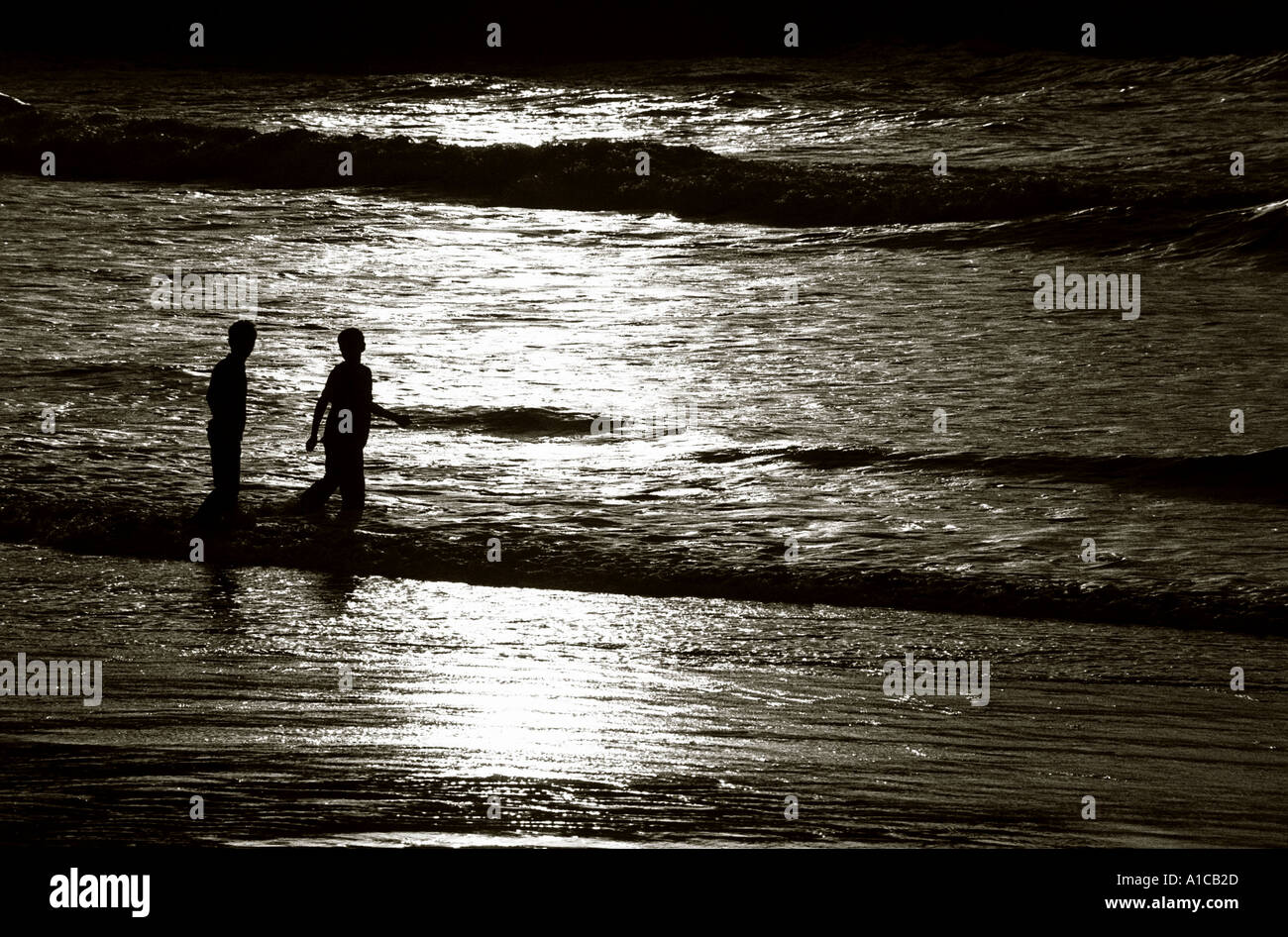 wading through waves Stock Photo - Alamy
