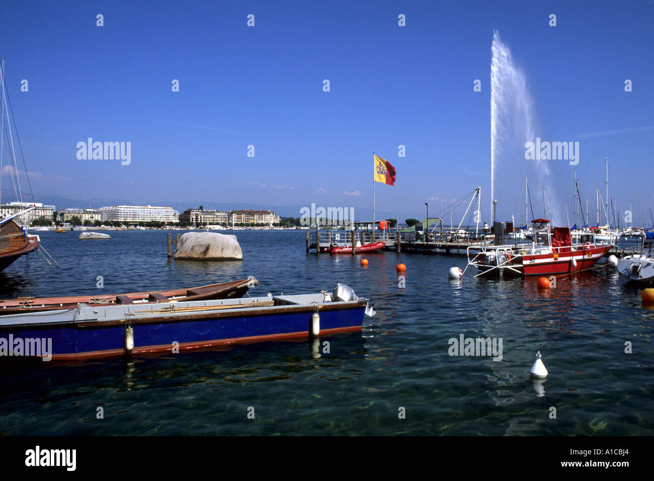 Switzerland Famous Lake Geneva with ship harbor and fountain in capital ...