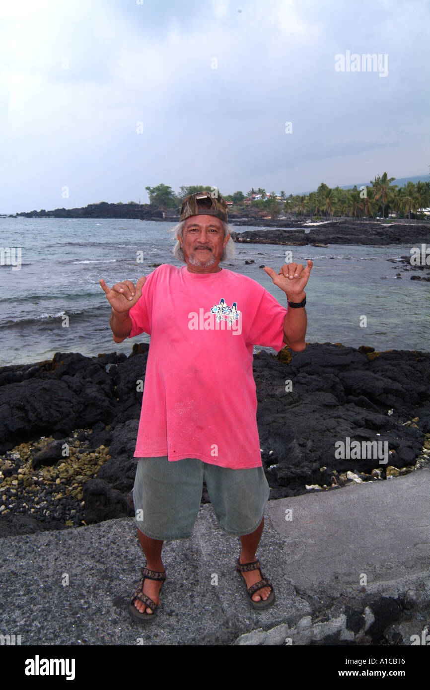 Native man making Hawaiian sign at remote village of Milolii South of ...