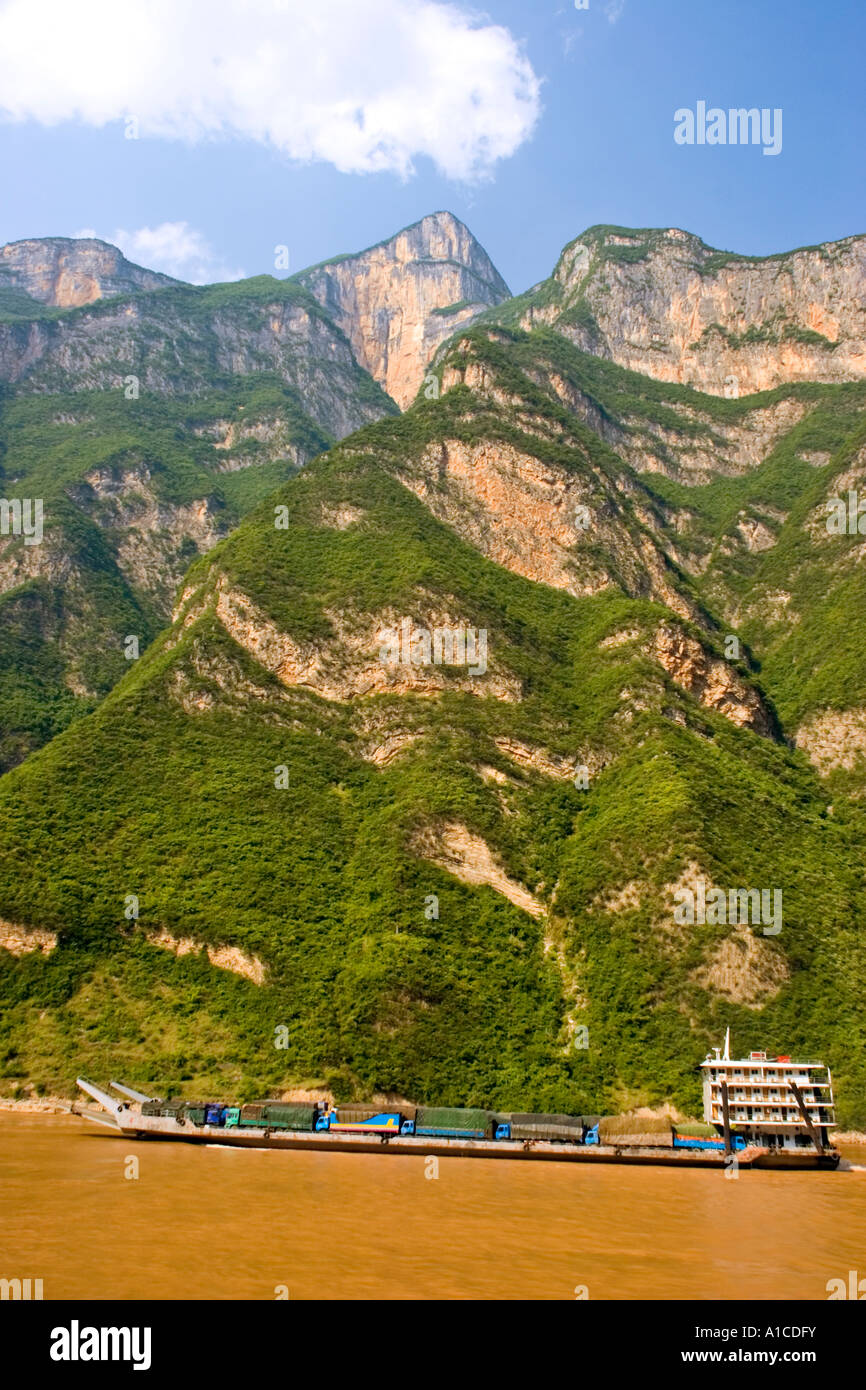 Cargo ship with a backdrop of vertical cliffs on the Banks of the ...