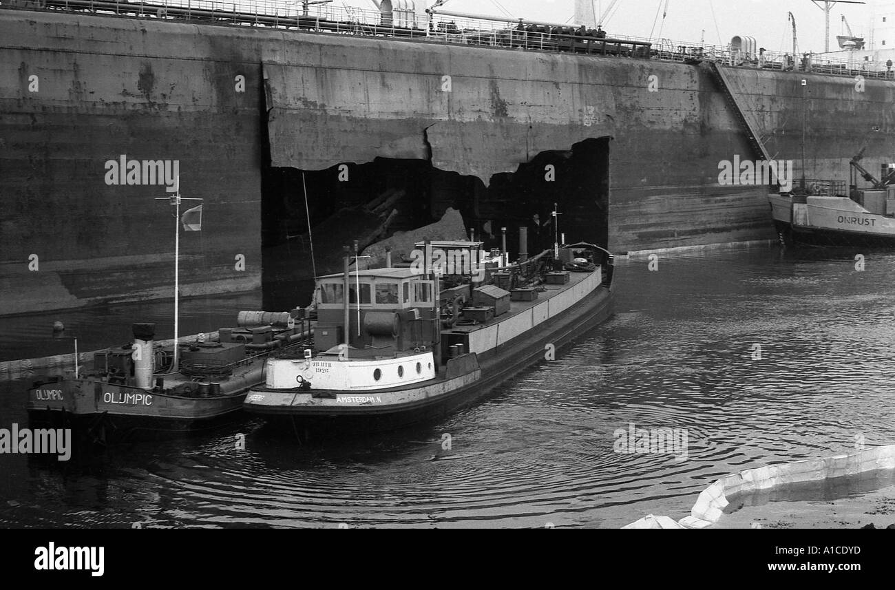 Large oil tanker with serious damage to the hull in an inlet at the sea ...