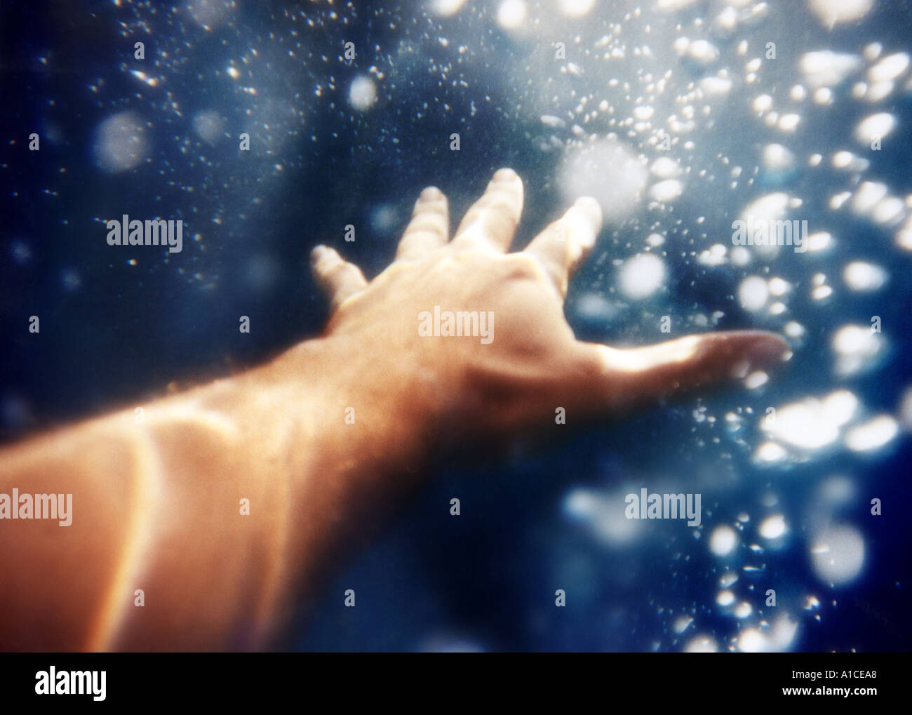 Hand underwater hi-res stock photography and images - Alamy