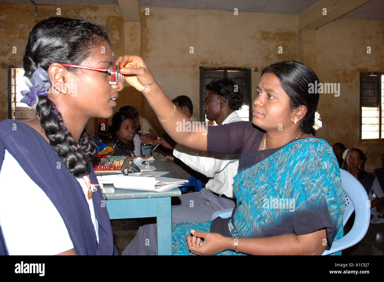 A young girl has an eye test at a screening camp in India Stock Photo ...