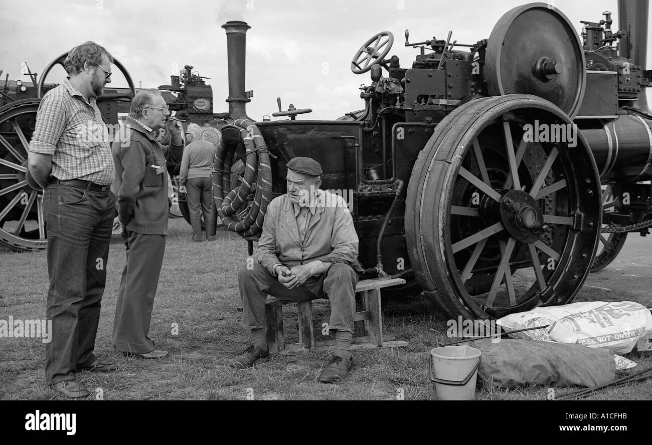 Group of men in front of traction engine with owner seated Stock Photo ...