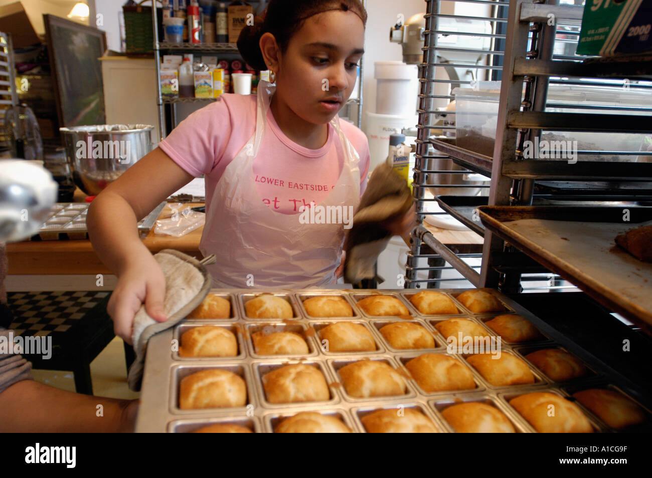 Girls from the Lower East Side Girls Club bake and frost cupcakes at ...