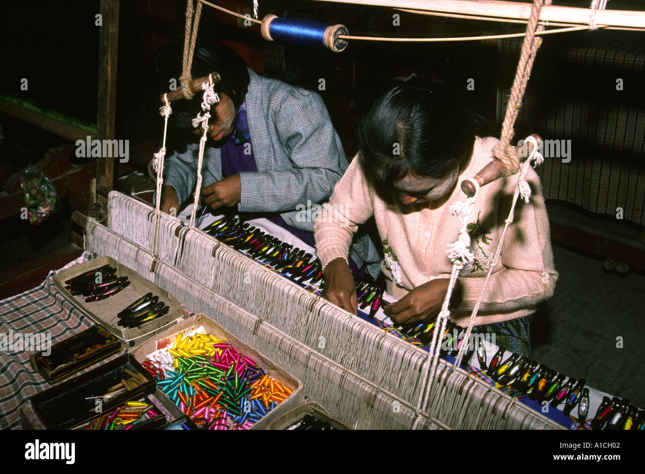 Myanmar Burma Mandalay crafts girls weaving silk at Acheik Lunyargyaw ...