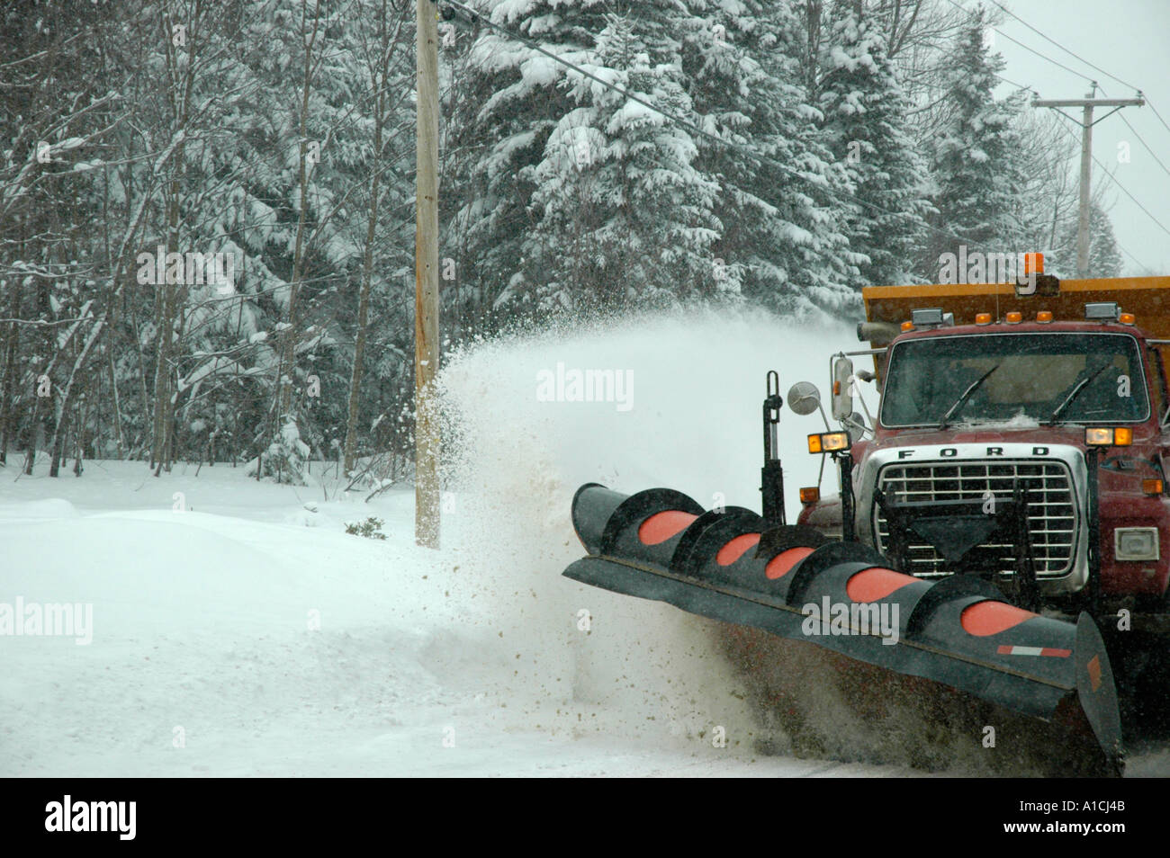 Snow plow clearing roads after major storm in the province of Quebec ...