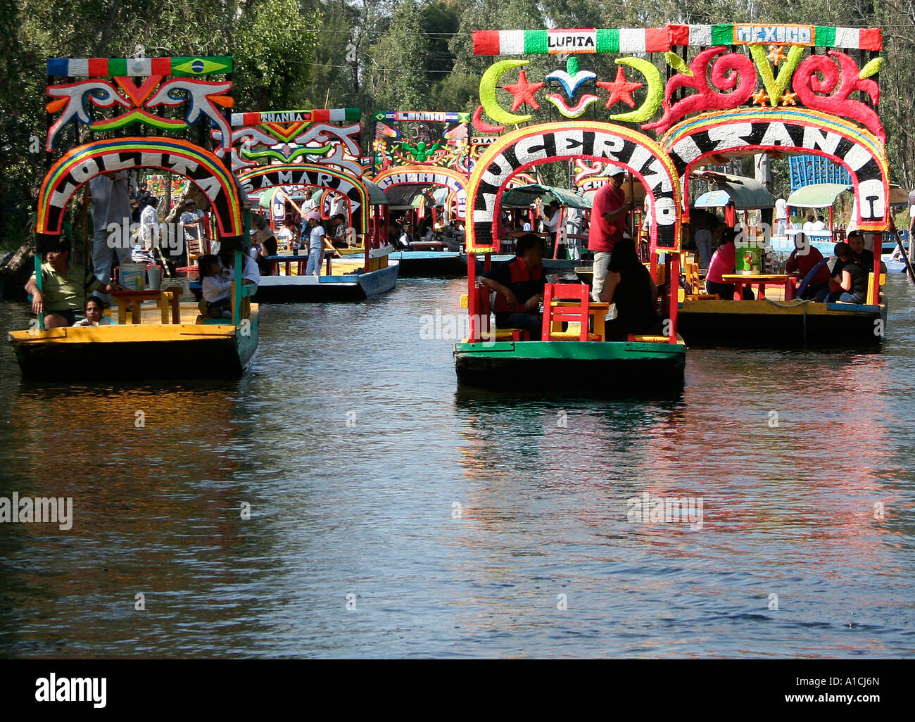 Traditional sunday family day out on the river in Xochimilco, Mexico ...