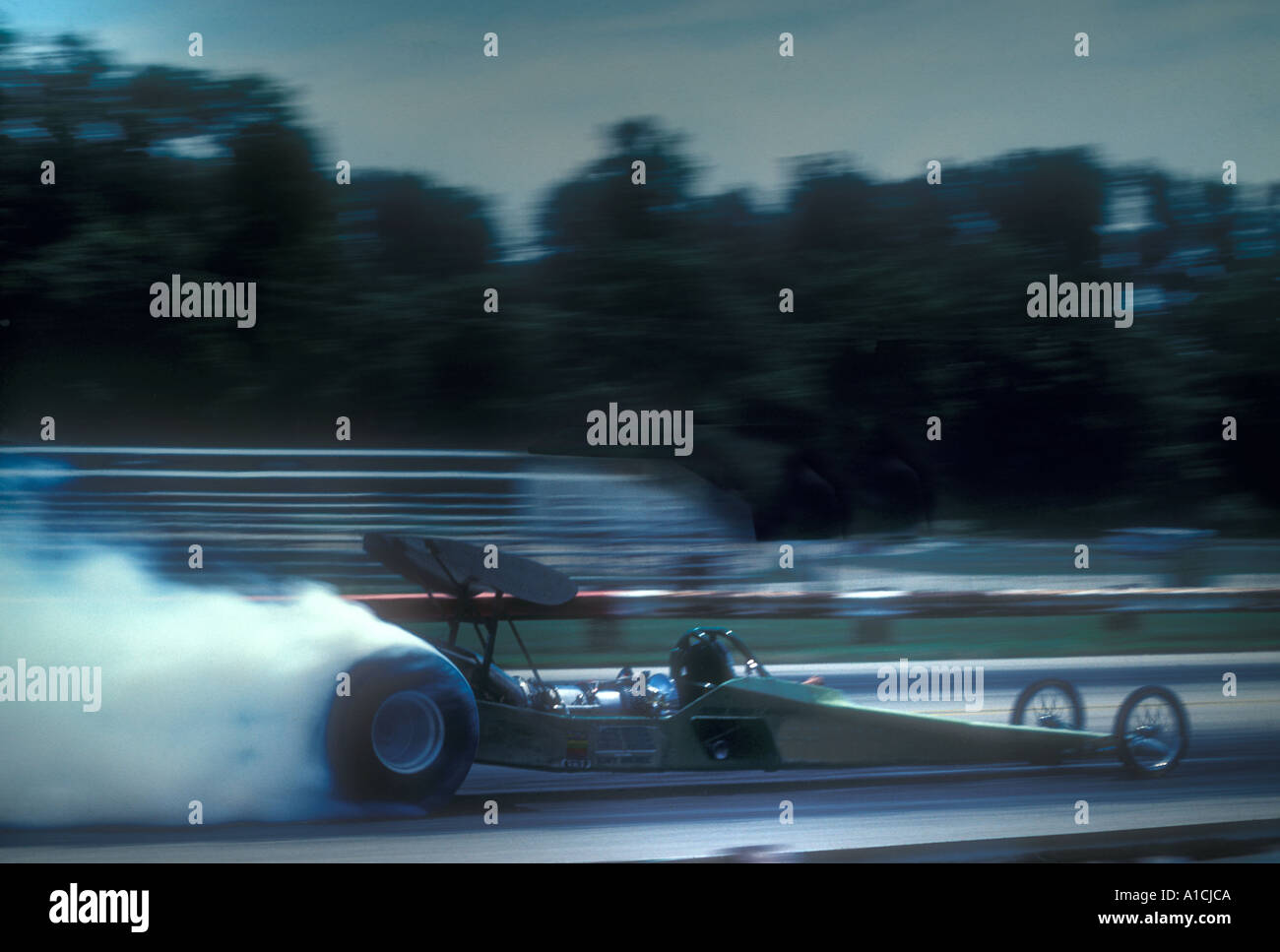 Drag Racer Spinning Tires Stock Photo - Alamy