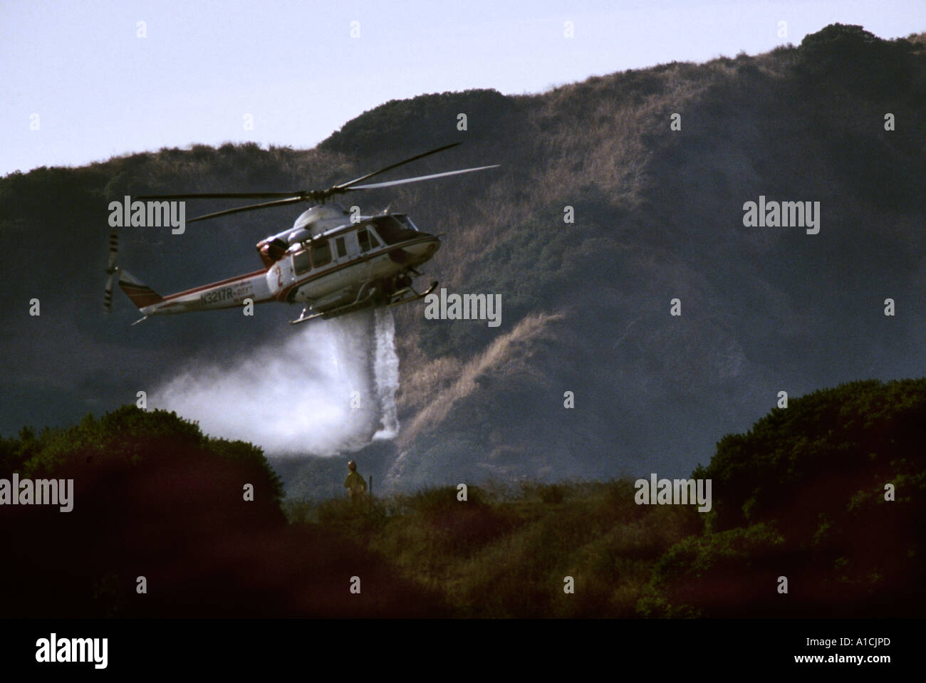 Helicopter dropping fire retardant on brush fire in Burbank, CA Stock ...