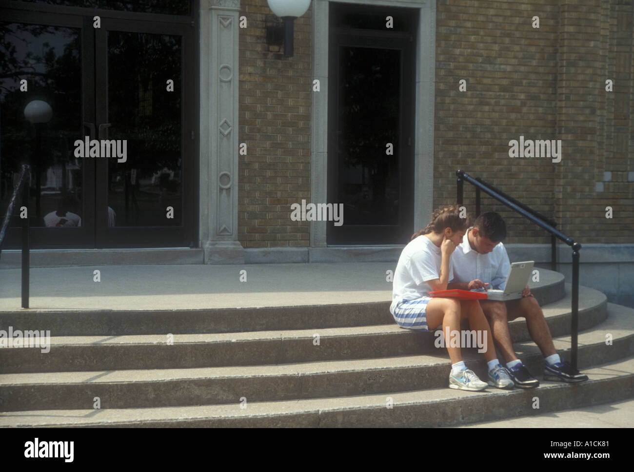 Studying Together on School Steps Stock Photo - Alamy