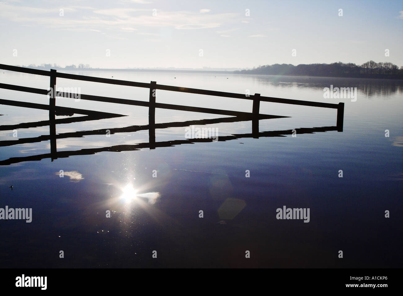 Fence in Water Stock Photo - Alamy
