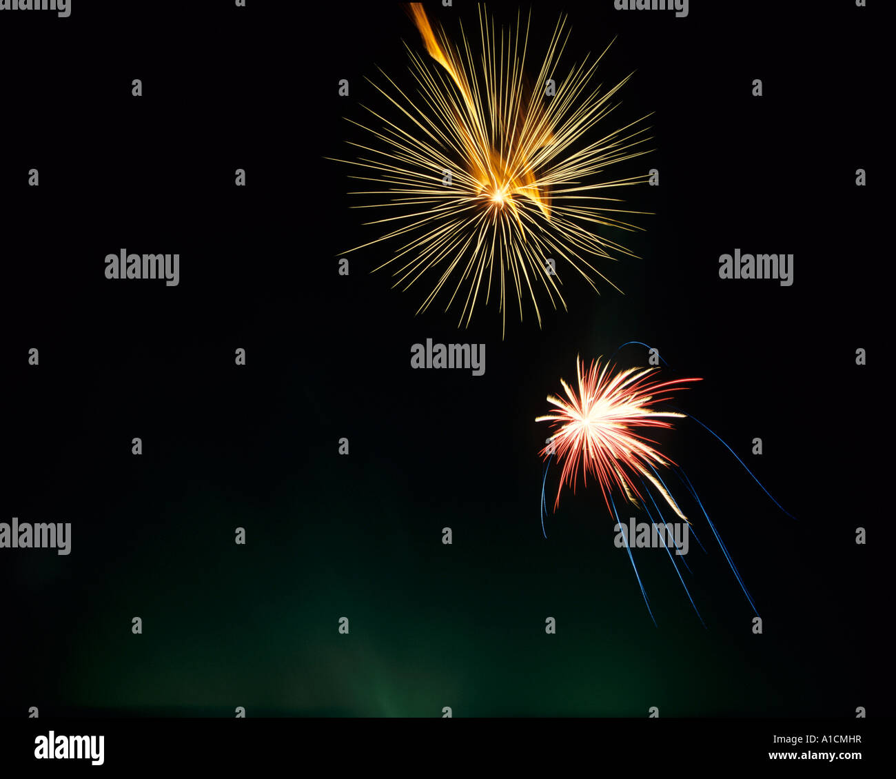 Fireworks exploding in celebration at night Stock Photo - Alamy