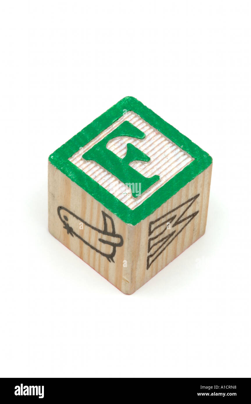 Children wooden learning block showing green alphabet F Stock Photo - Alamy
