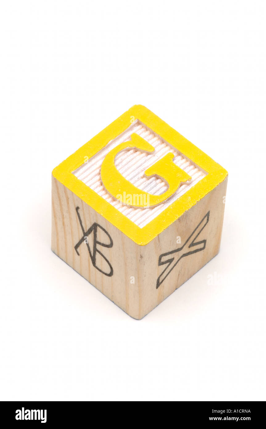 Children wooden learning block showing yellow alphabet G Stock Photo ...