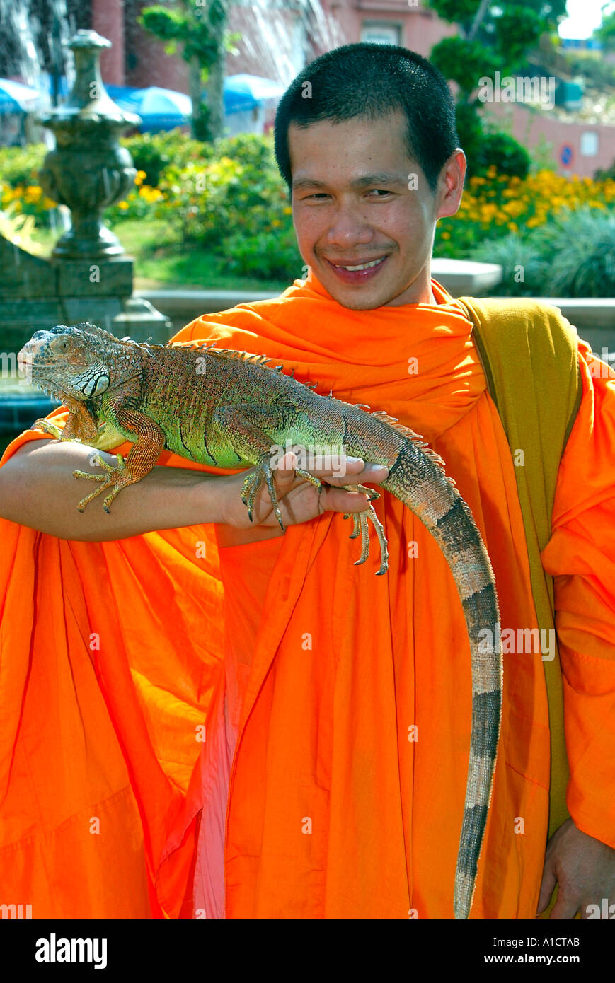 Monk poses with giant lizard Queen Victoria memorial fountain Dutch ...