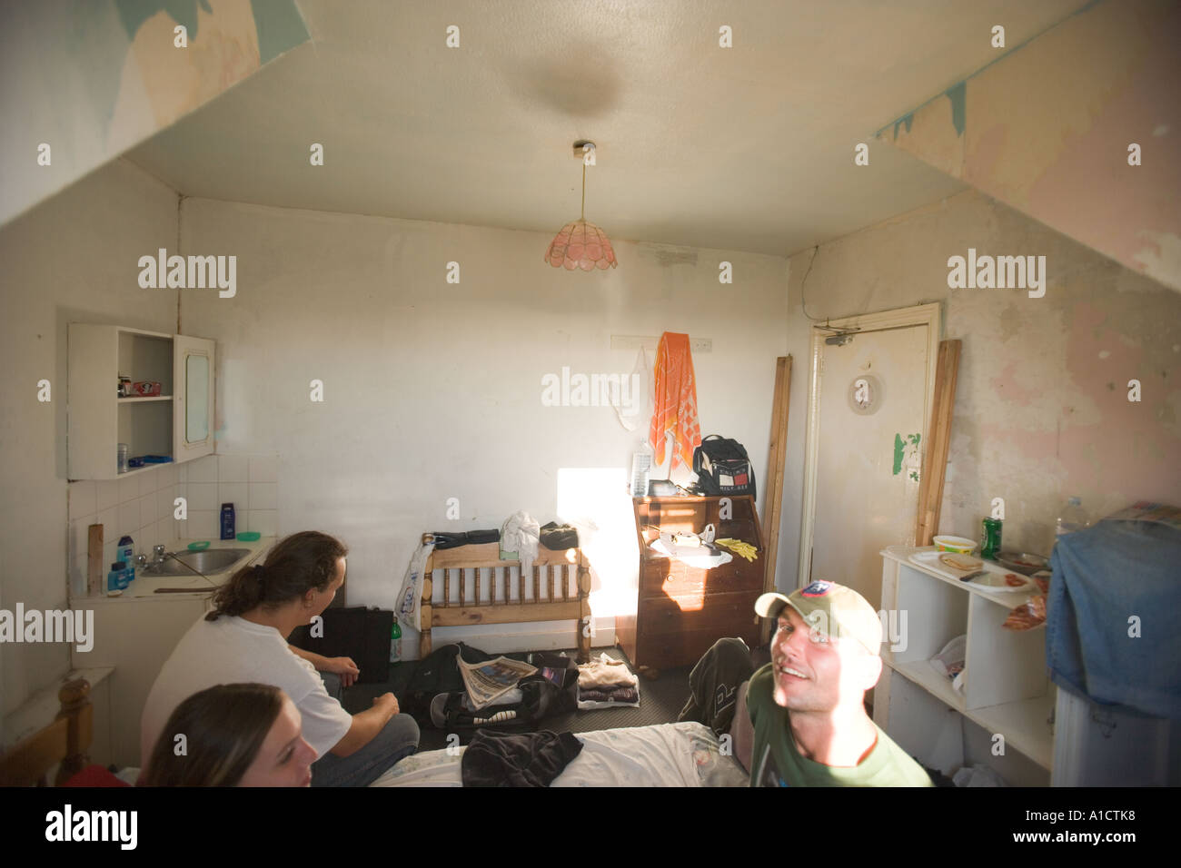 Three drug addicts in a messy room Stock Photo - Alamy