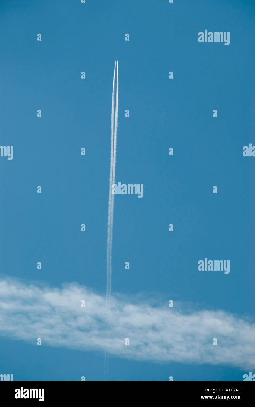 aircraft contrails in blue sky Stock Photo - Alamy