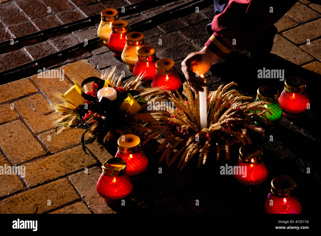 People lighting candles Stock Photo - Alamy