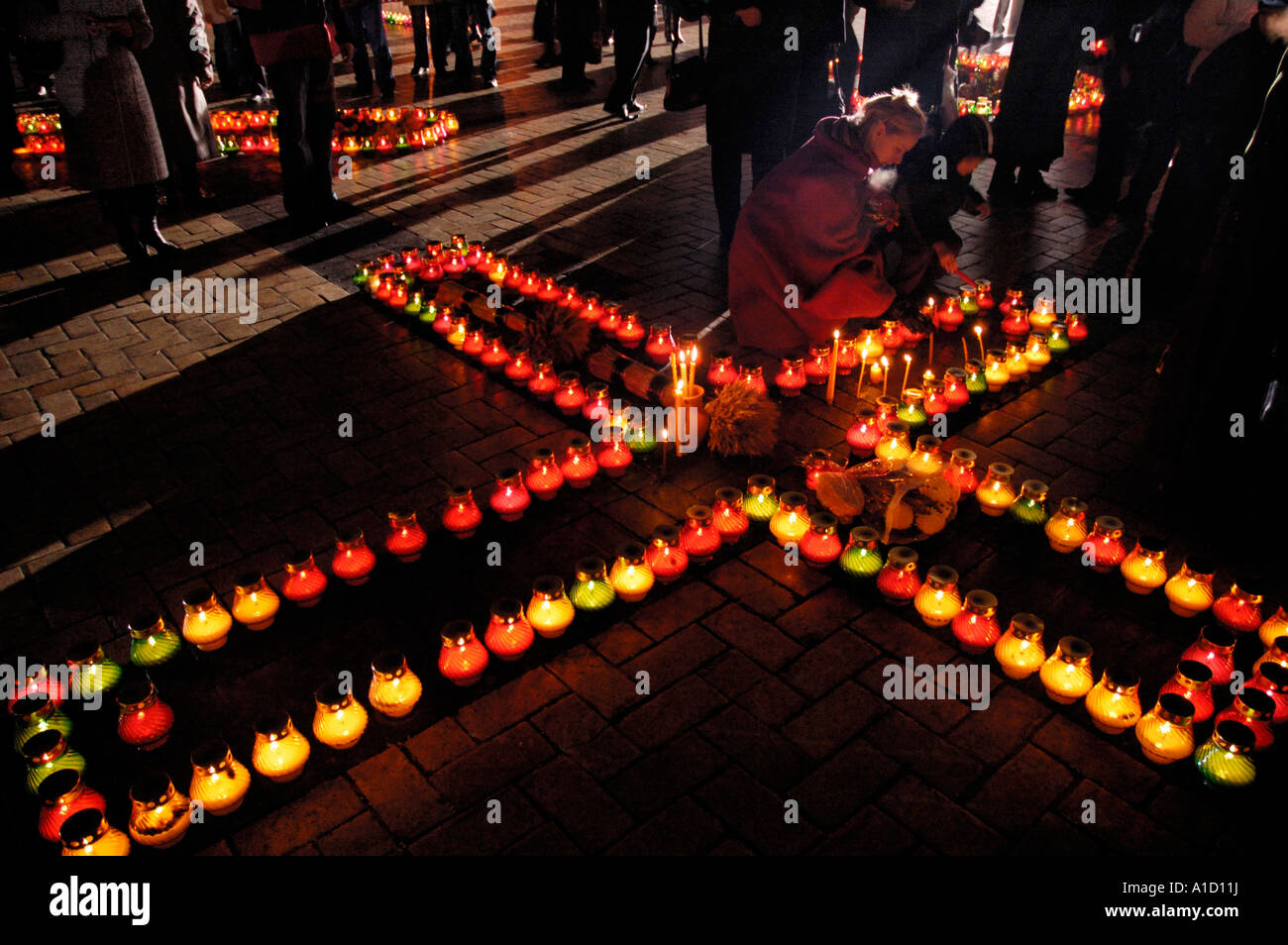 People lighting candles Stock Photo - Alamy