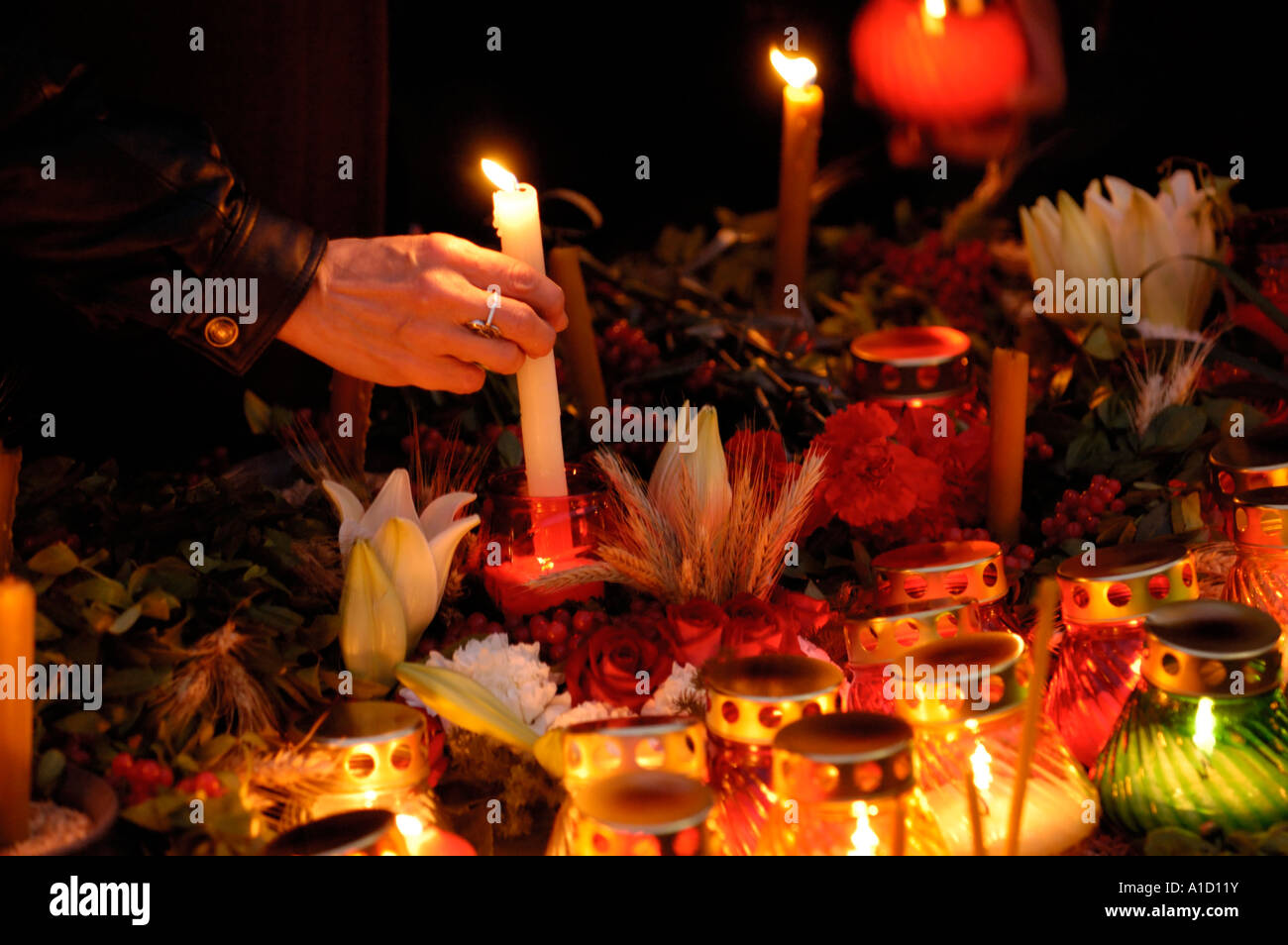 People lighting candles Stock Photo - Alamy