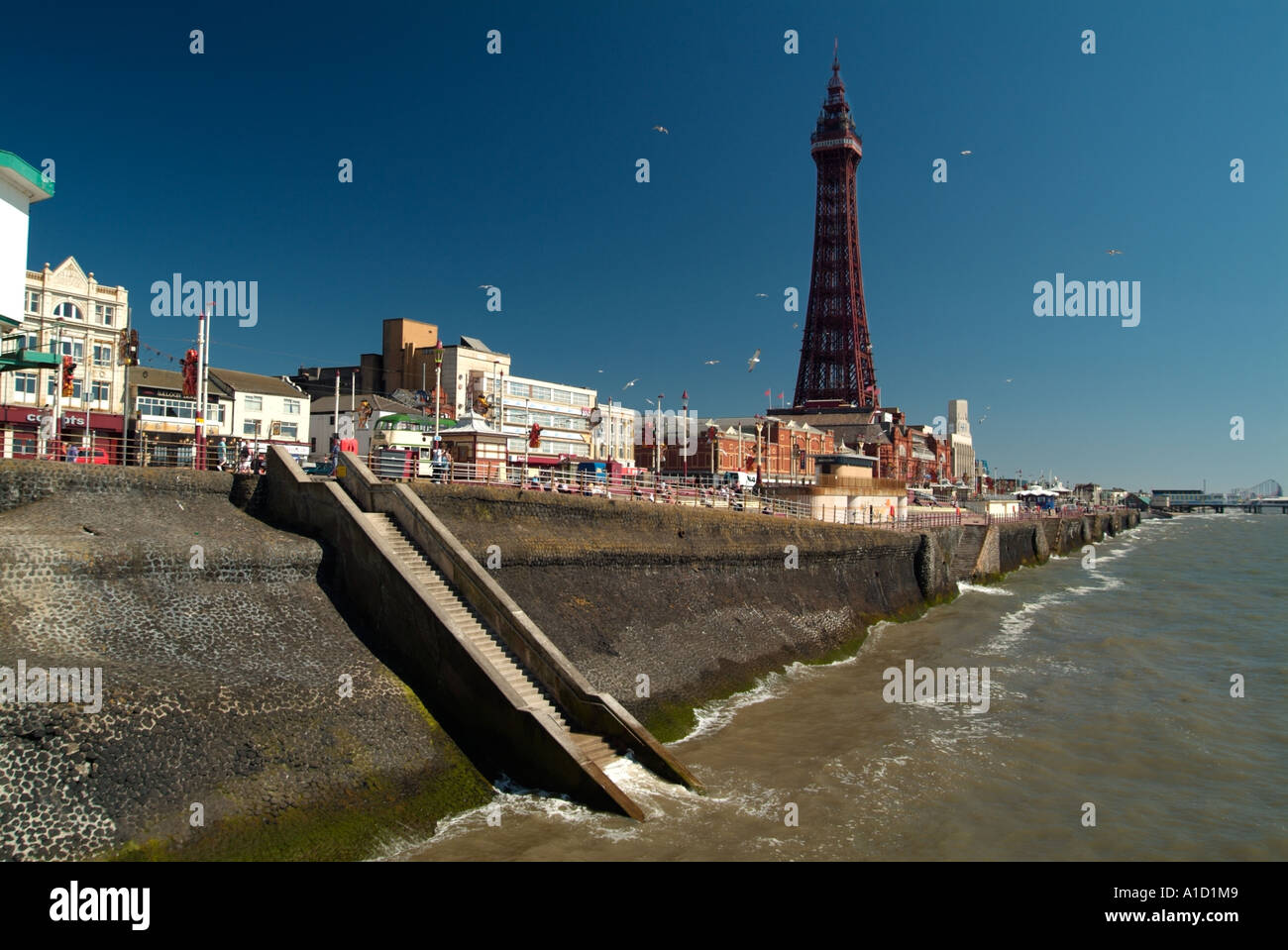 high tide at Blackpool seafront with Blackpool Tower in the distance ...
